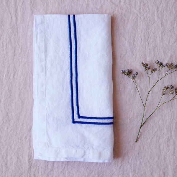 Double Piped Linen Napkins in White, Set of Four | Over The Moon